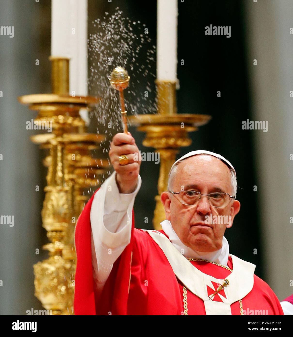 Pope Francis blesses the altar as he celebrates a mass of Pentecost in ...