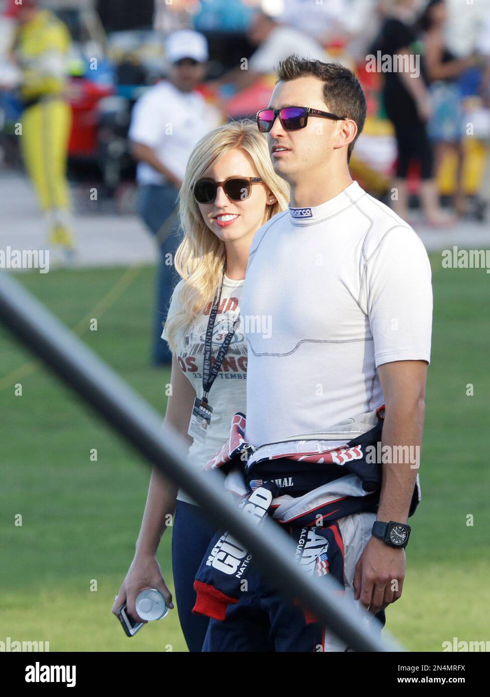 Graham Rahal, right, walks with his girlfriend NHRA driver Courtney ...