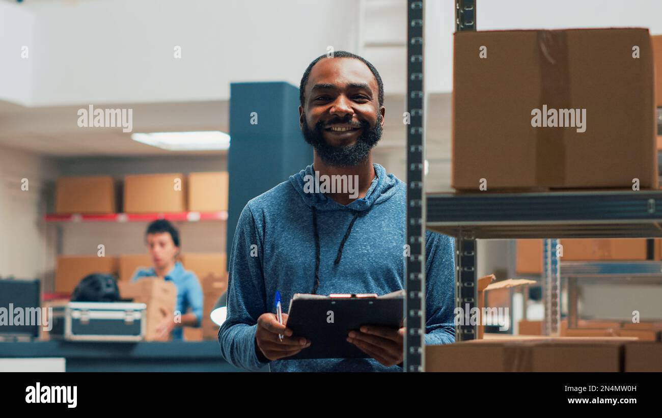 Woman taking inventory in warehouse hi-res stock photography and images ...