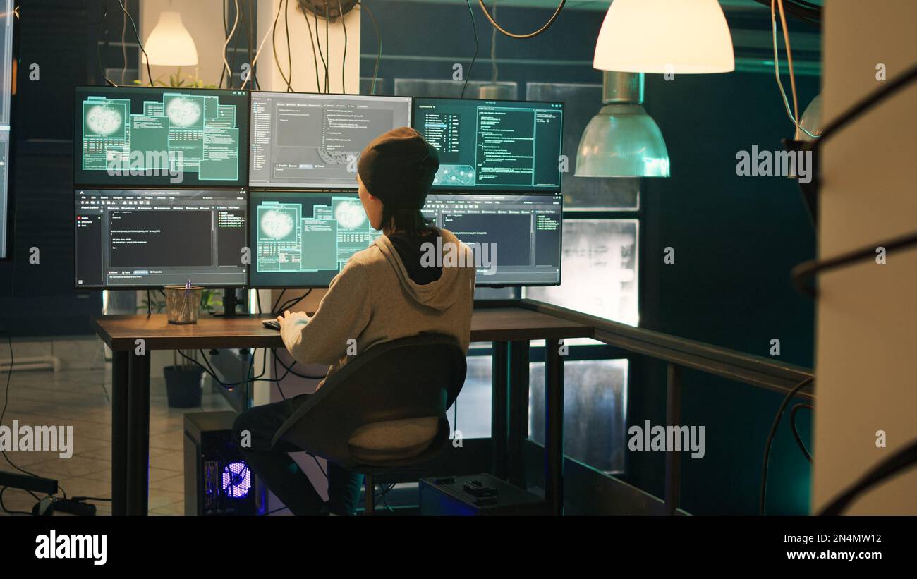 Team of people hacking system with computer malware, working on ...