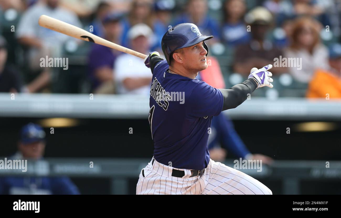 Colorado Rockies' Brandon Barnes follows the flight of his RBI-triple ...
