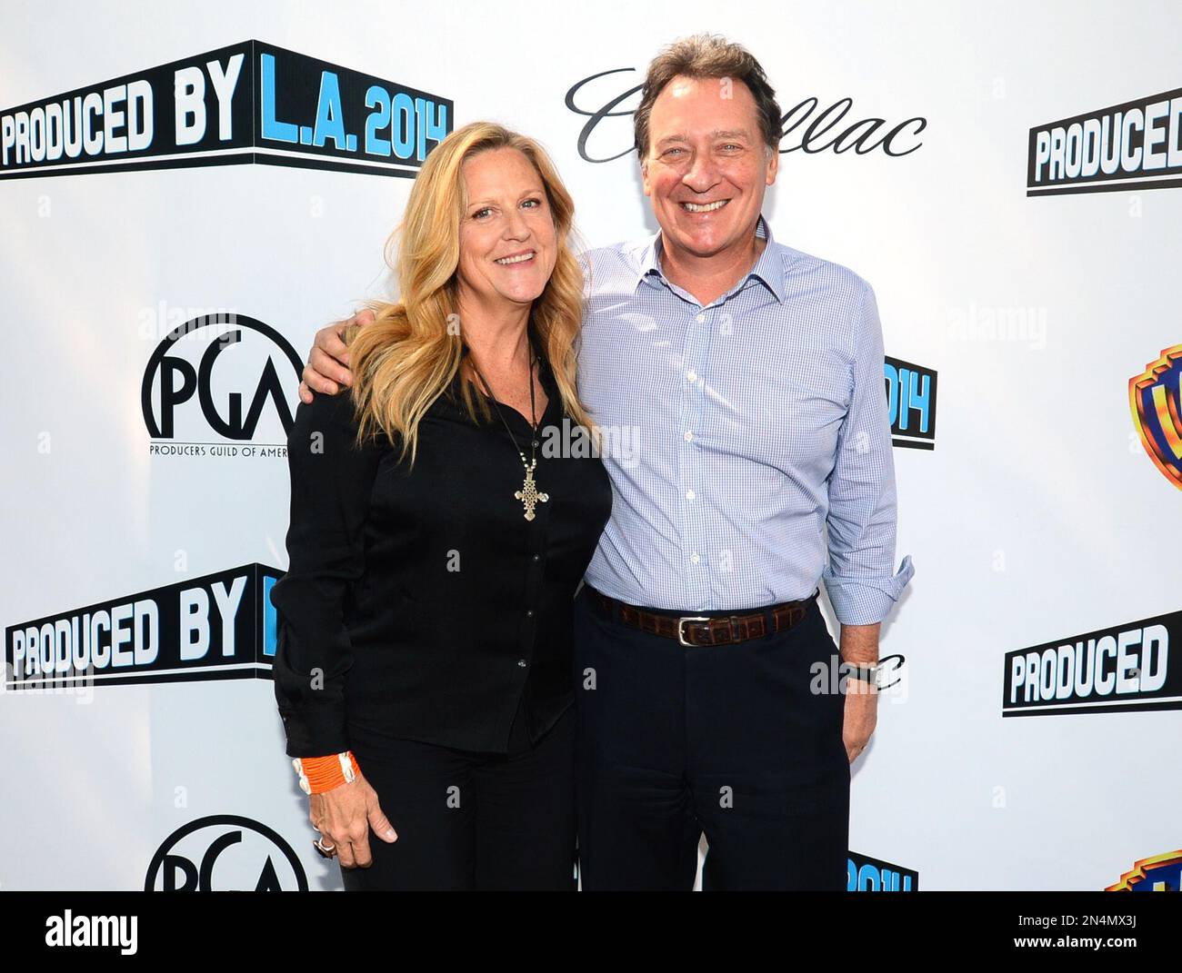 Lori McCreary, left, and Gary Lucchesi arrive at the 2014 Produced By ...