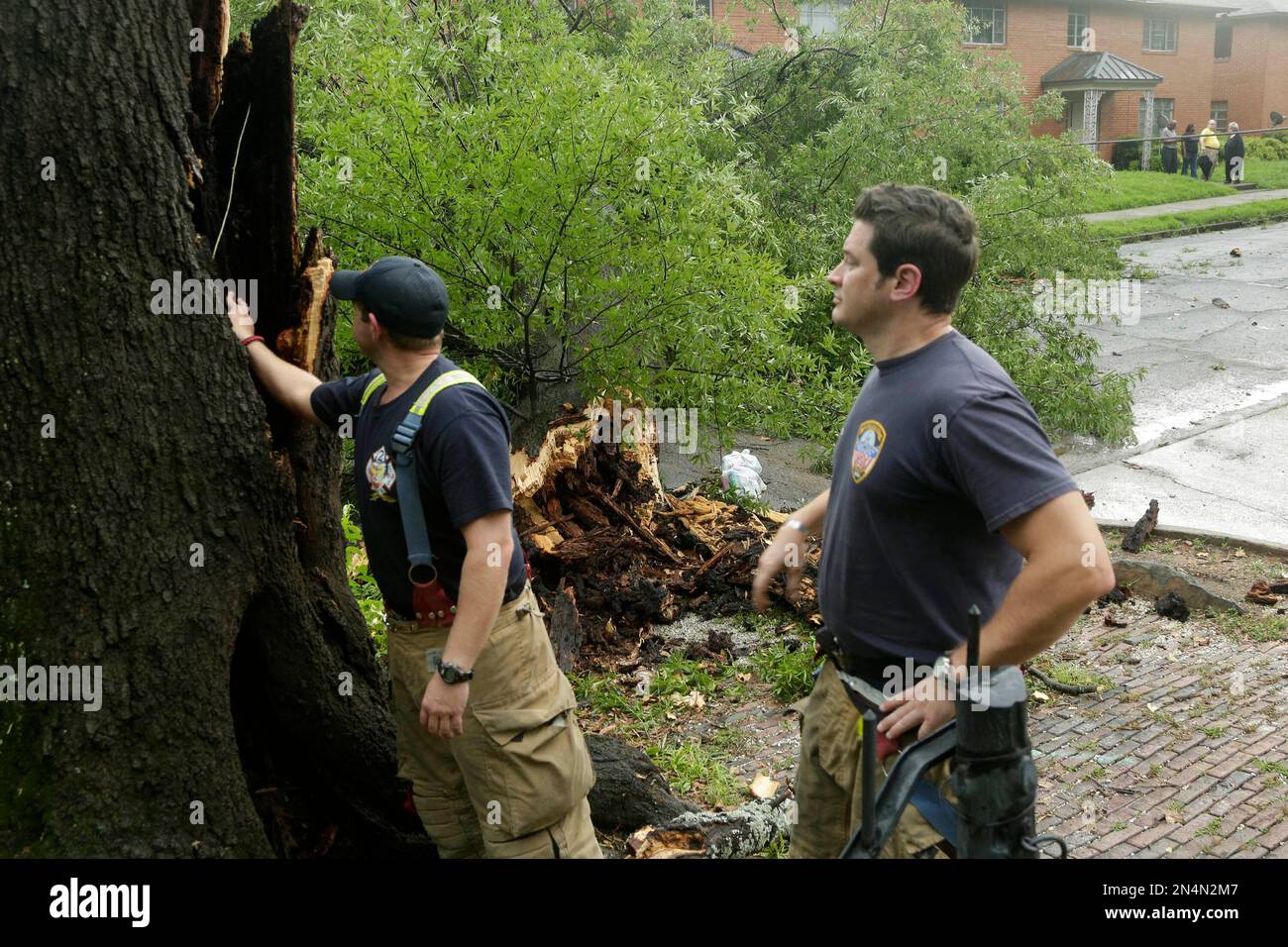 Little Rock firefighters Brandon Gattis, left, and Brad Sanders examine ...