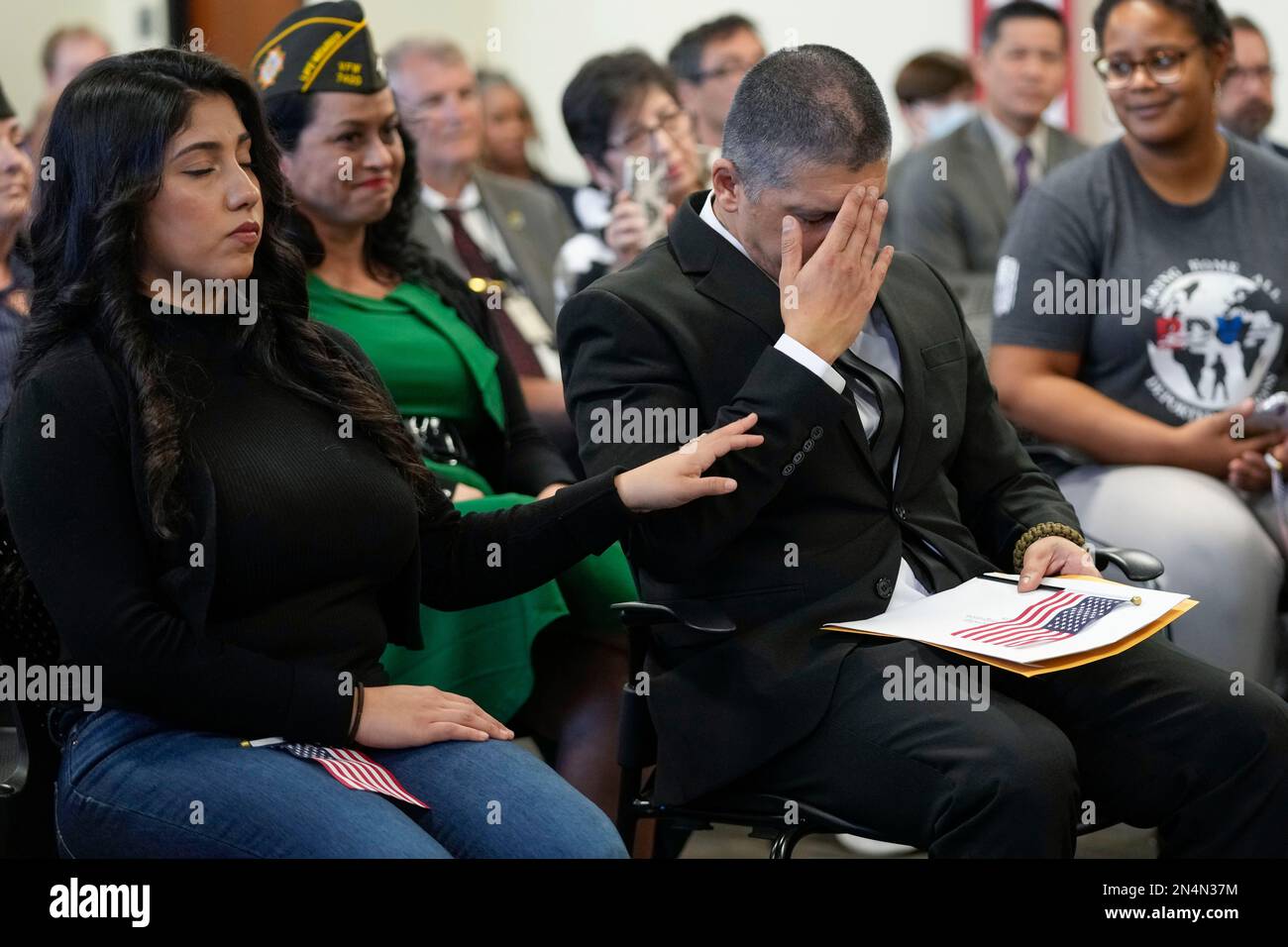 Deported veteran Mauricio Hernandez Mata, right, reacts alongside his ...