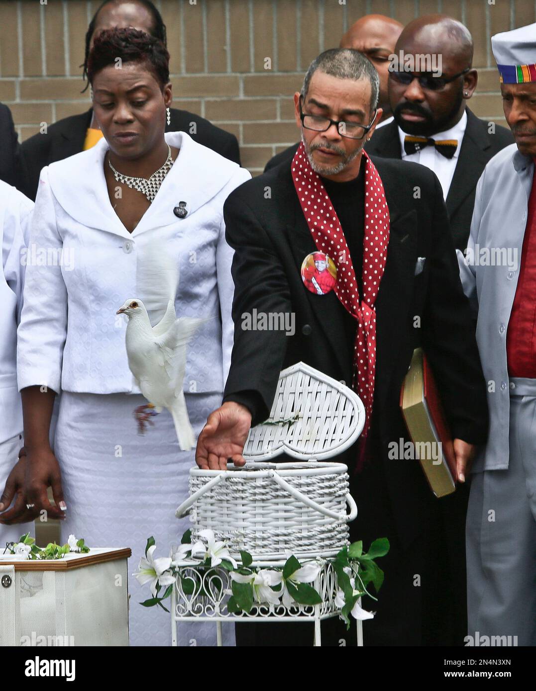 Aricka McClinton, left, and Nicholas Avitto, center, release white ...