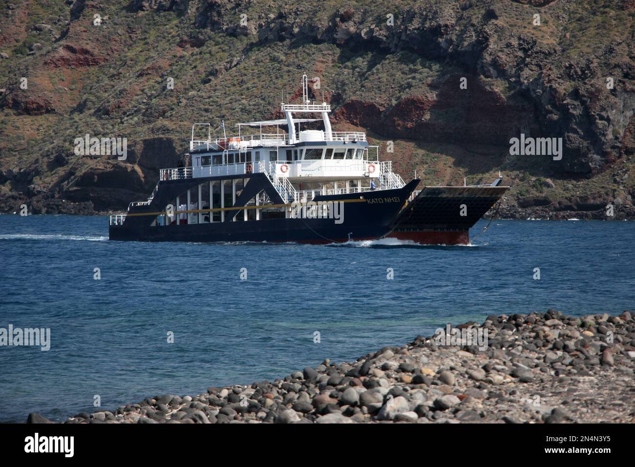 A small vehicle transport ship operating at Riva port on Thirasia ...