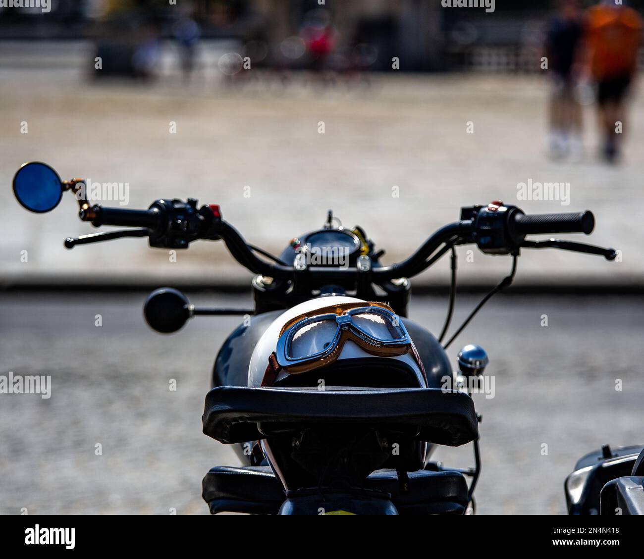 A helmet for safe riding on a motorcycle parked on the street on a ...