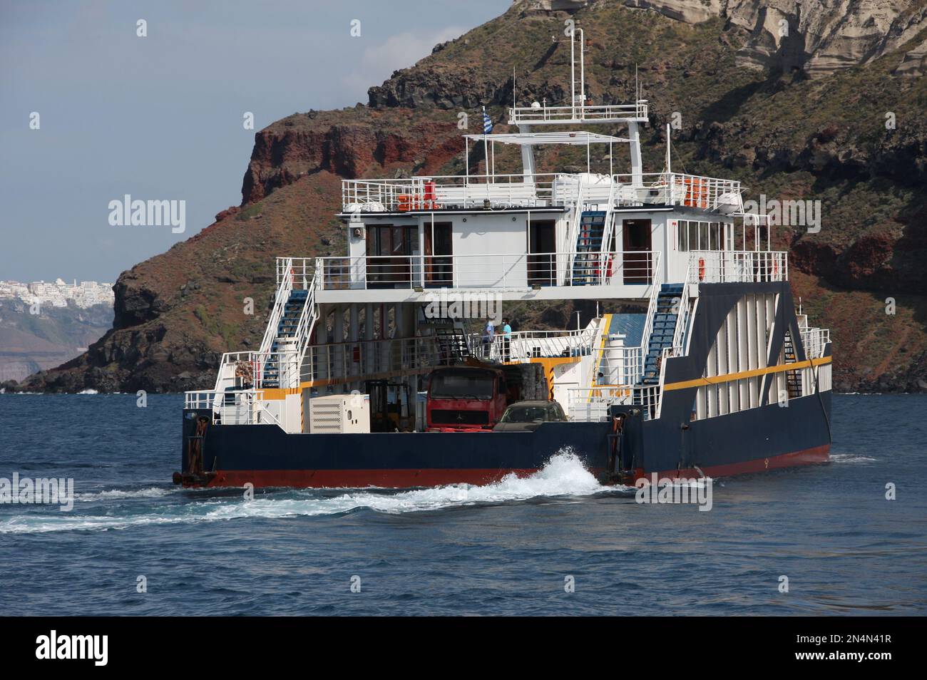 A small vehicle transport ship operating at Riva port on Thirasia ...