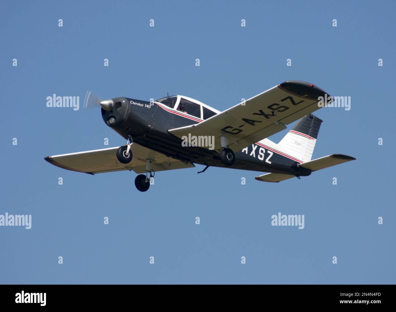 A Piper PA-28-140 Cherokee B departs Sandown airfield Isle of Wight UK ...