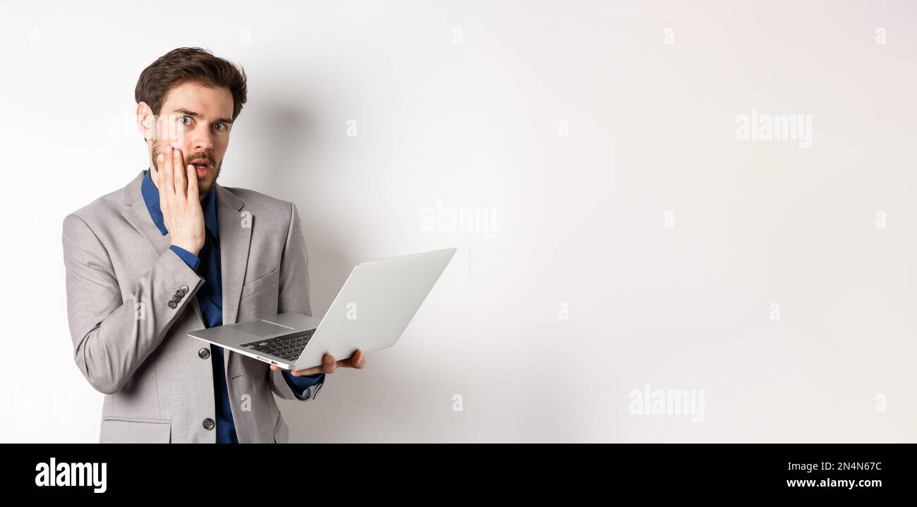 Shocked adult salesman standing hi-res stock photography and images - Alamy