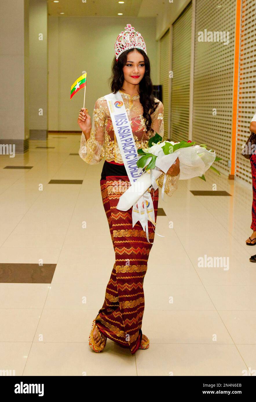 In this June 5, 2014 photo, Myanmar model May Myat Noe waves a ...