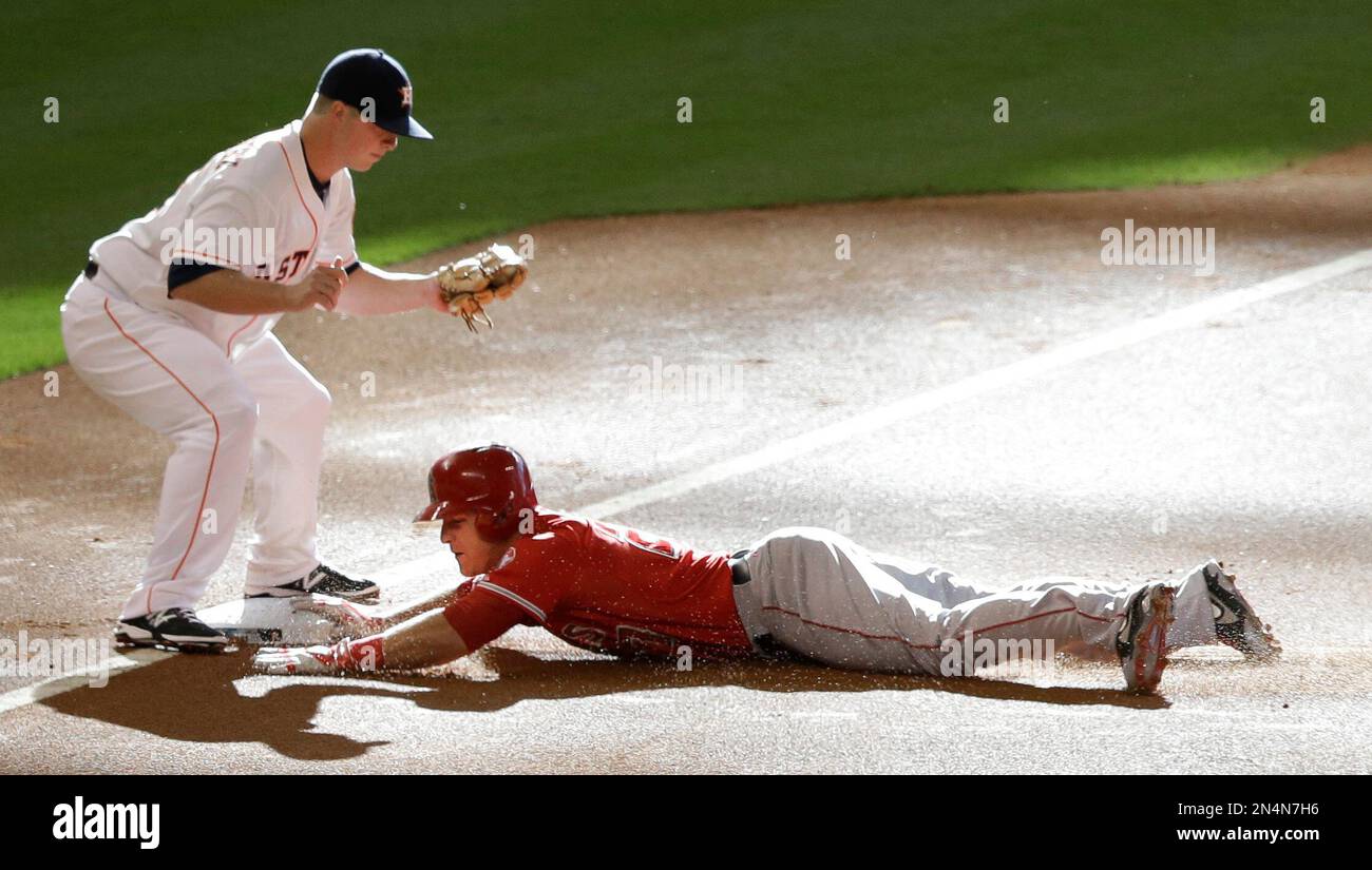 Los Angeles Angels' Mike Trout, right, is safe at third base for a ...