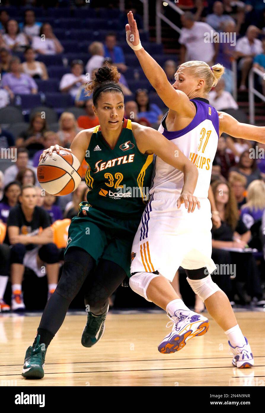 Seattle Storm's Alysha Clark (32) drives past Phoenix Mercury's Erin ...