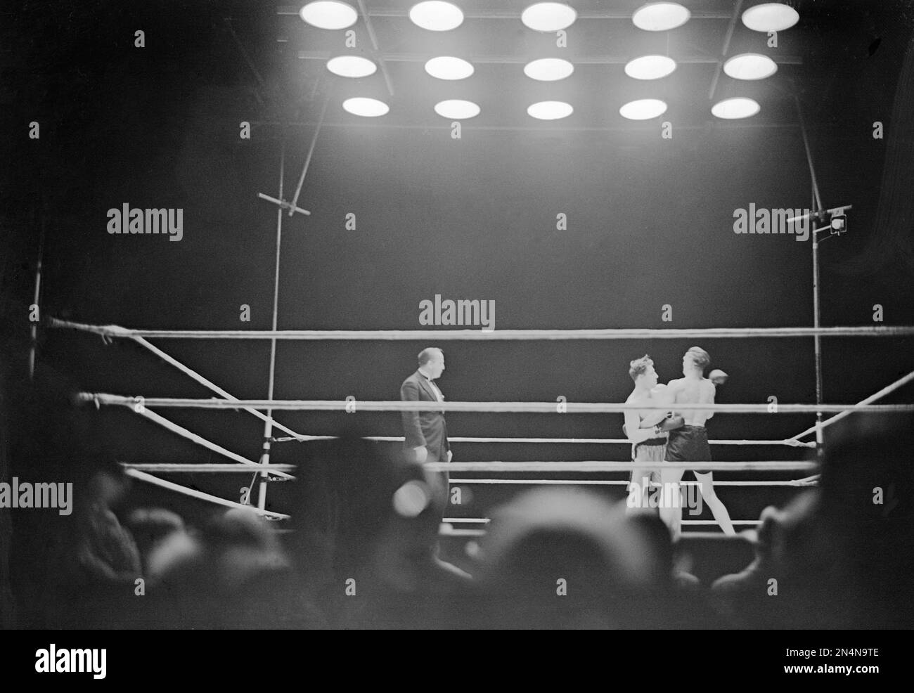 Champion Len Harvey of England, left, holds on to Jack Petersen of ...