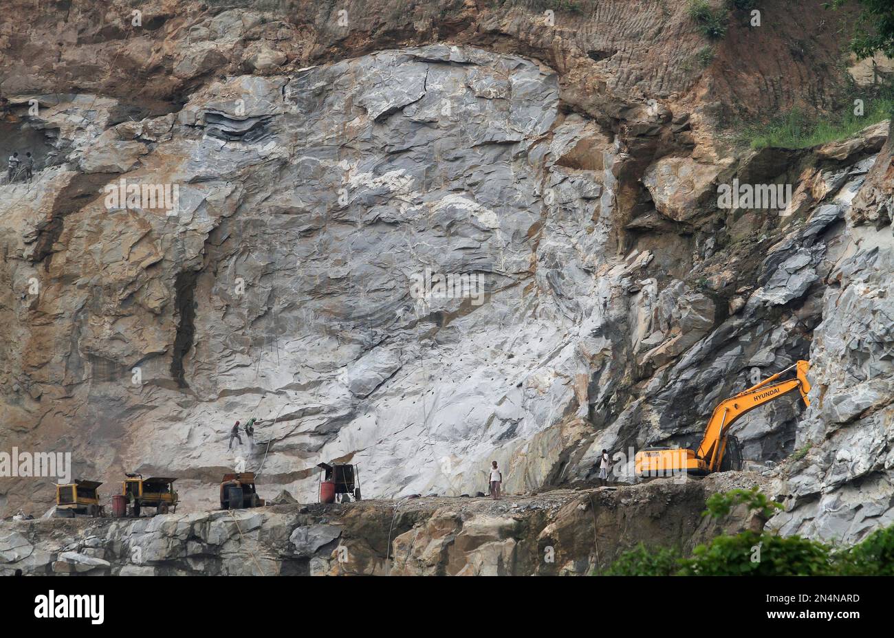 Indian laborers prepare to blast a stone quarry on World Environment ...