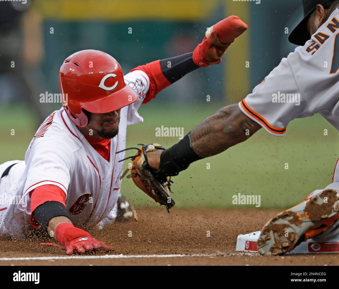 Cincinnati Reds' Billy Hamilton, left, is tagged out by San Francisco ...