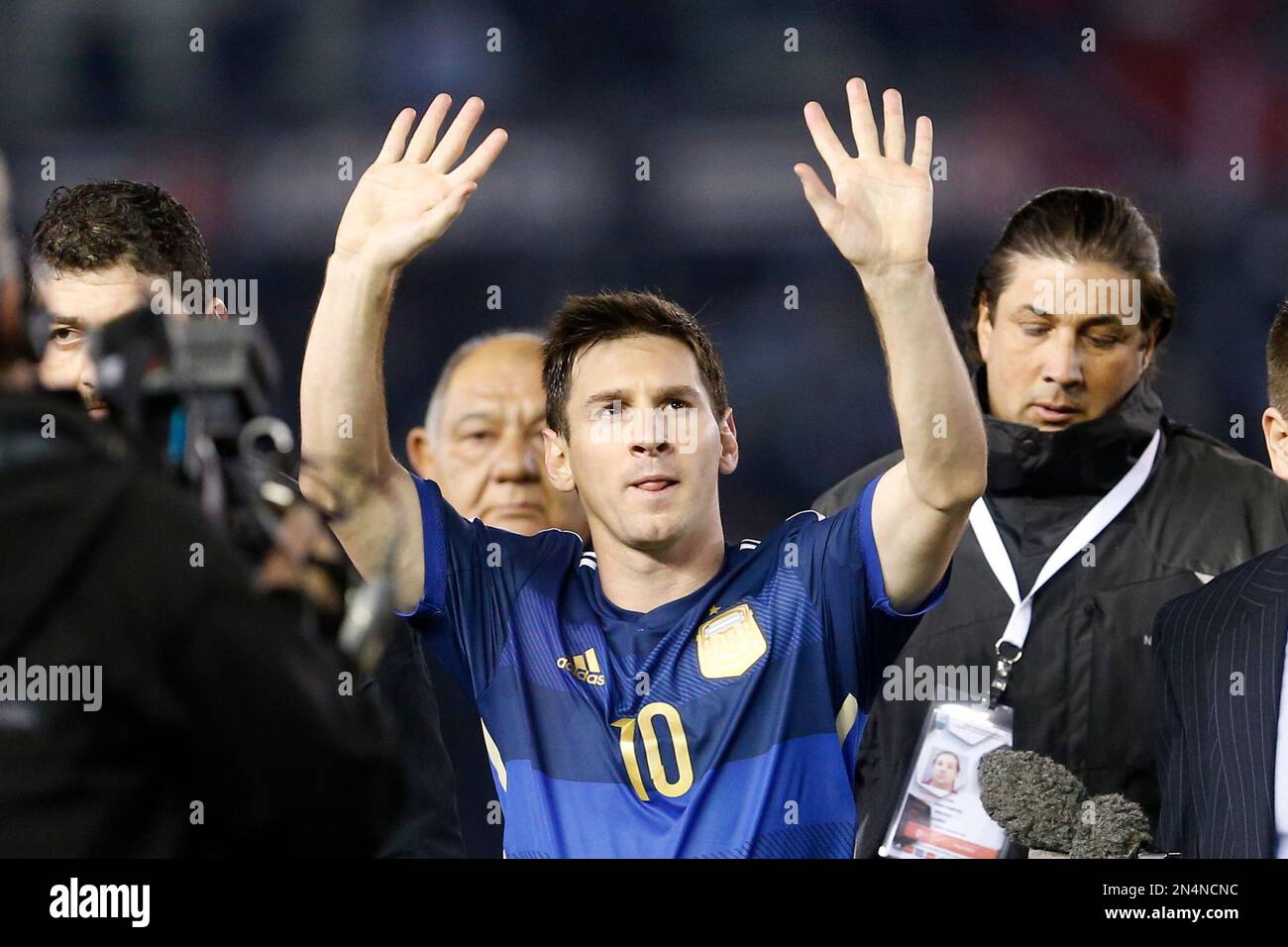 Argentina's Lionel Messi waves to fans at the end of an international ...