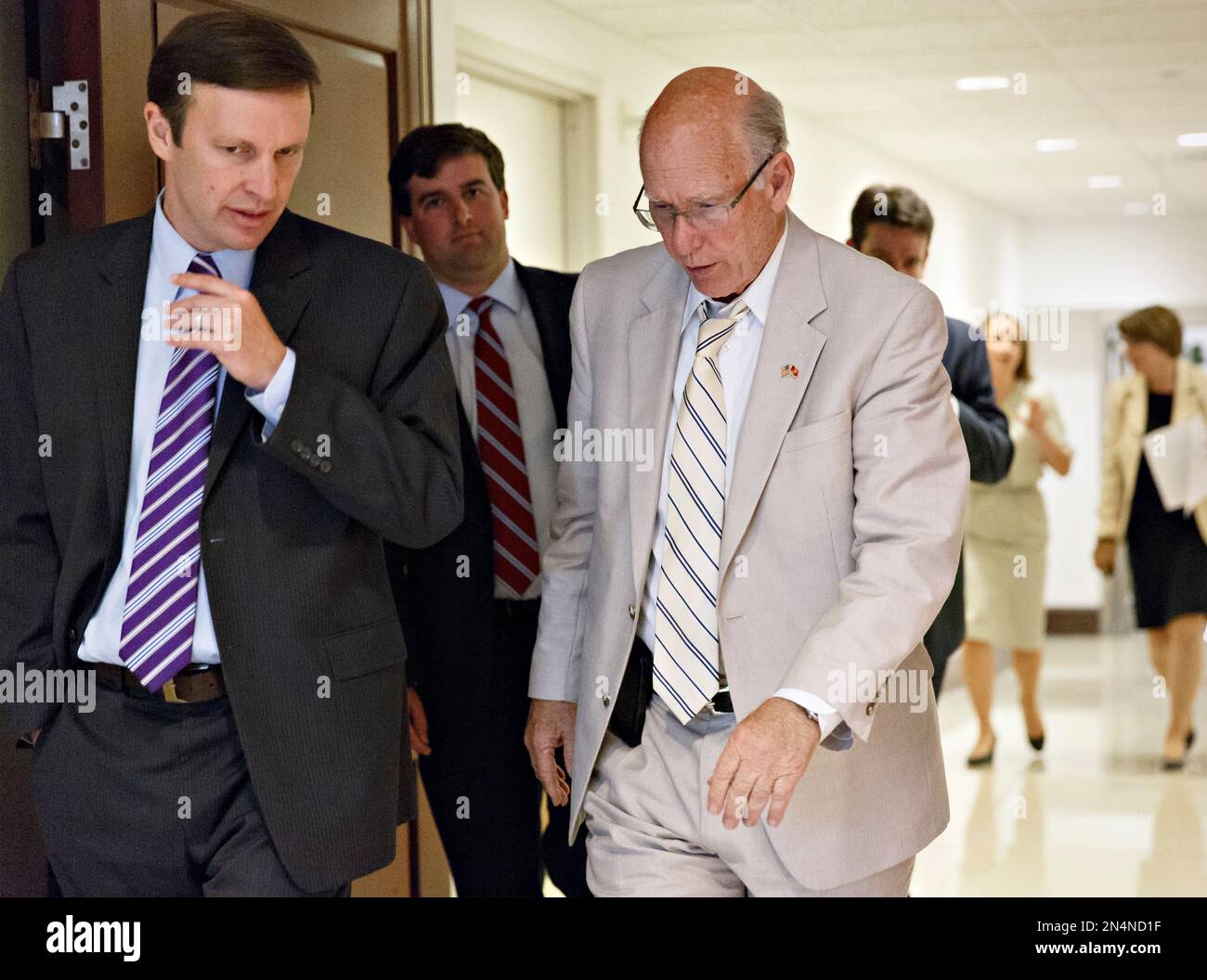 Sen. Chris Murphy, D-Conn., left, confers with Sen. Pat Roberts, R-Kan ...
