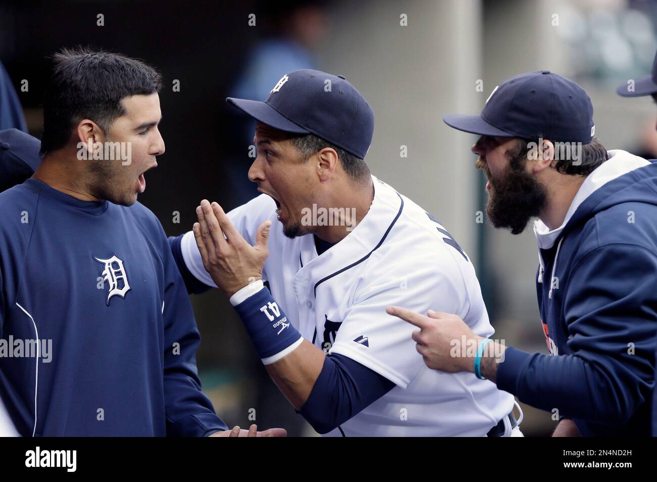 Detroit Tigers designated hitter Victor Martinez, center, and relief ...
