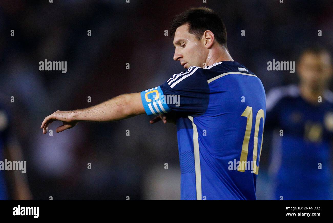 Argentina's Lionel Messi fixes his captain band during an international ...