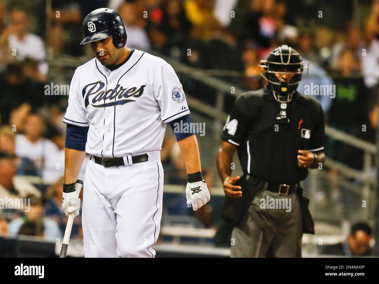 San Diego Padres' Carlos Quentin walks back to the dugout after ...