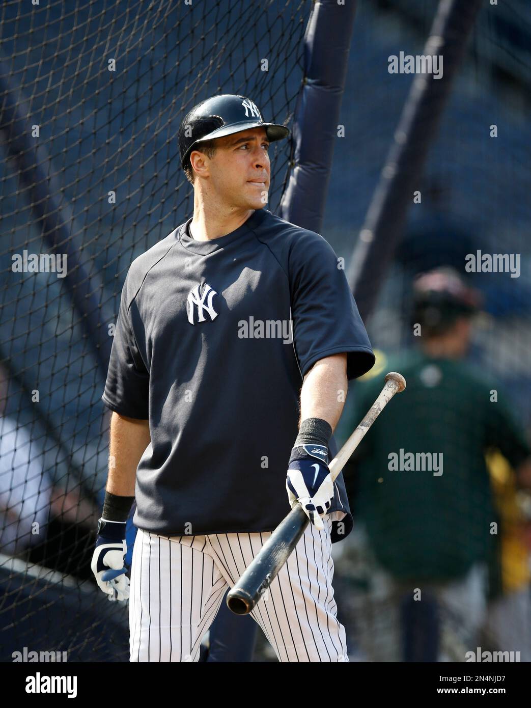 New York Yankees first baseman Mark Teixeira looks to the outfield ...