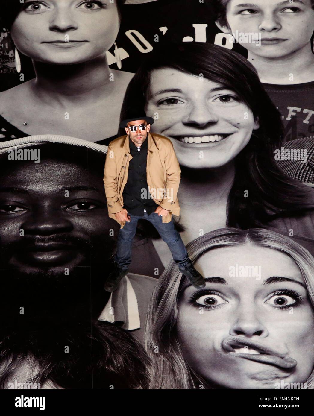 French street artist and photographer JR poses on his creation during ...