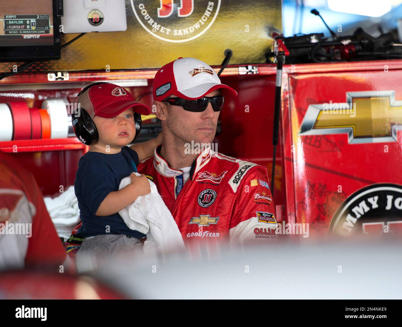 Kevin Harvick holds his son Keelan before practice for NASCAR Sprint ...