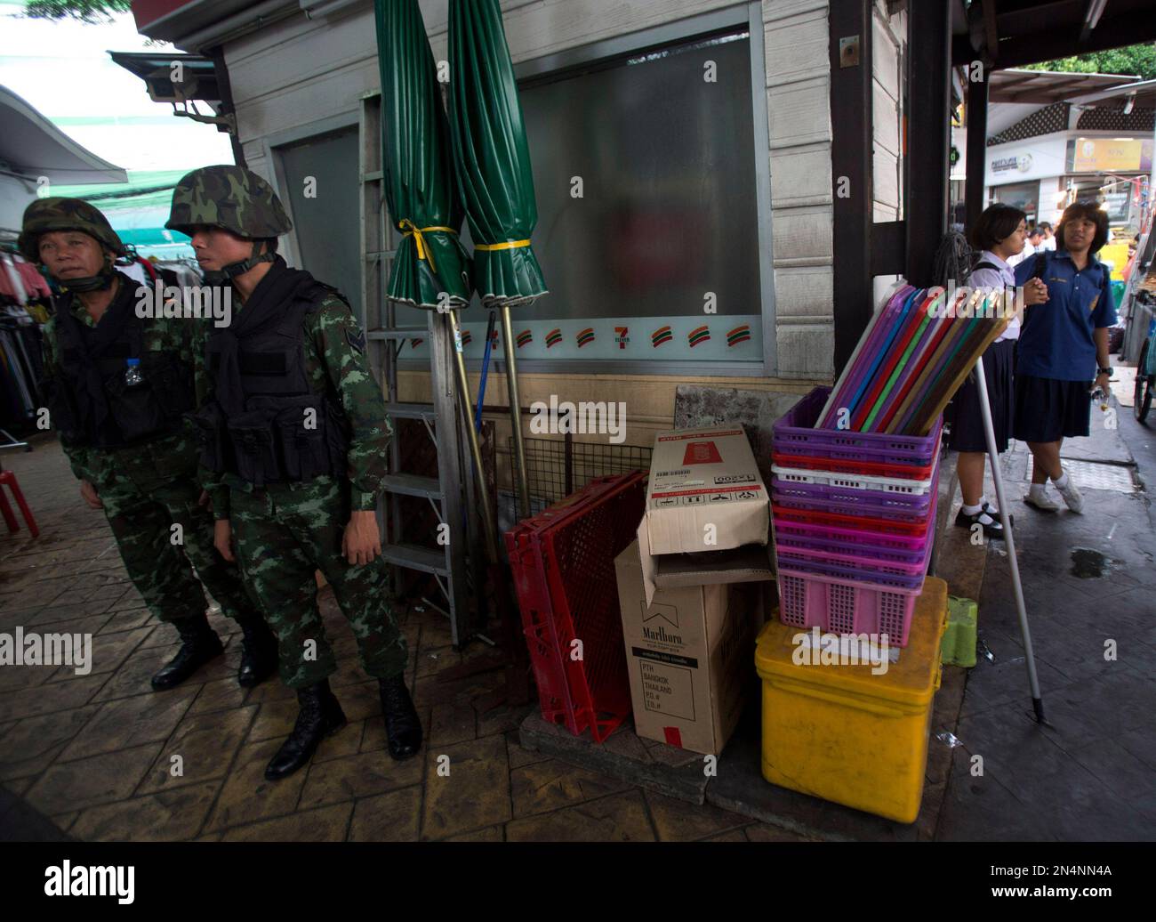 Thai soldiers guard at a convenience store to prevent anti-coup ...