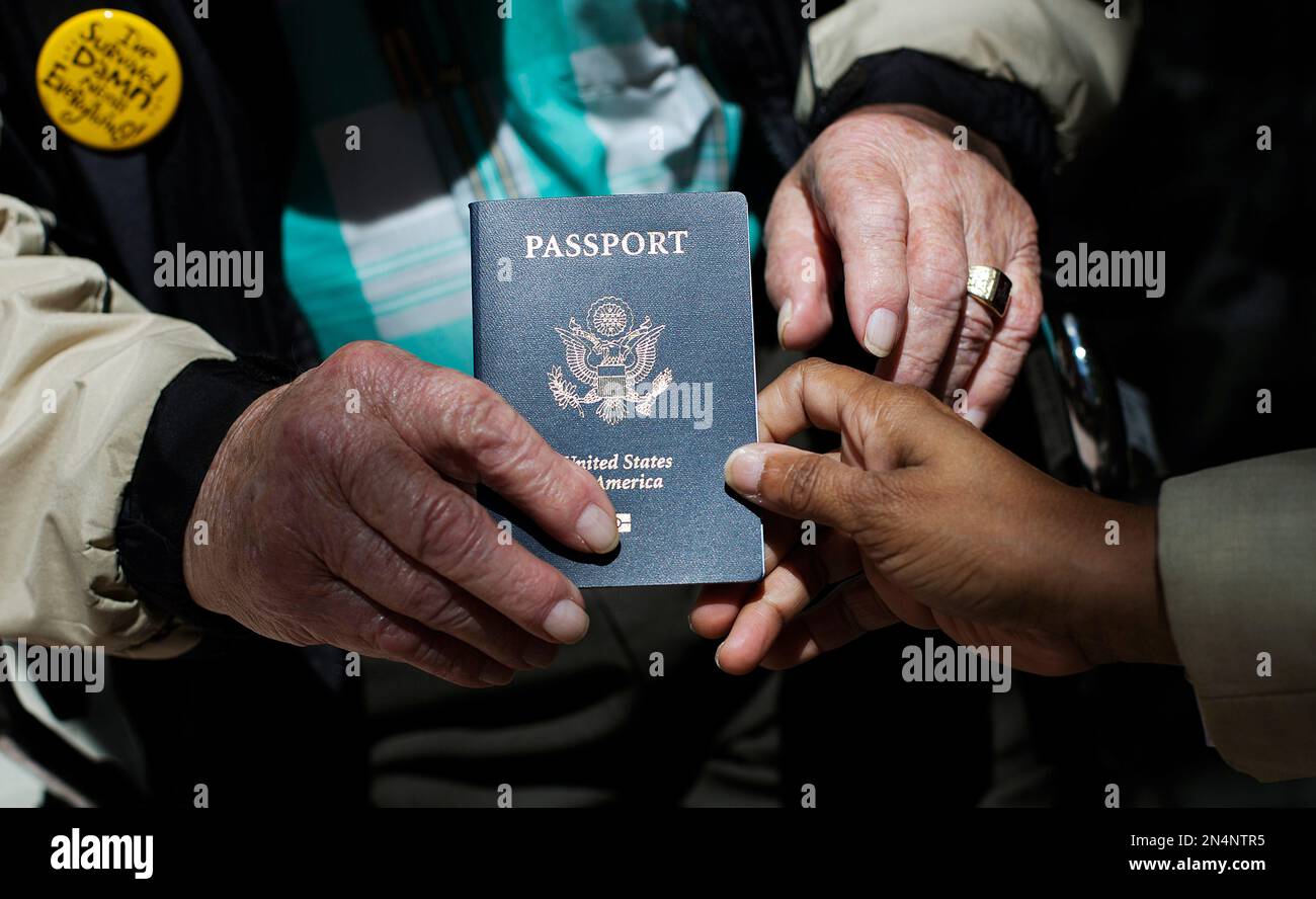 Ninety-four-year-old World War II veteran Sherwin Callander is handed ...