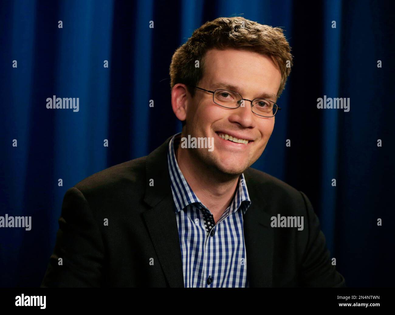 John Green, author of "The Fault in Our Stars," poses during an ...