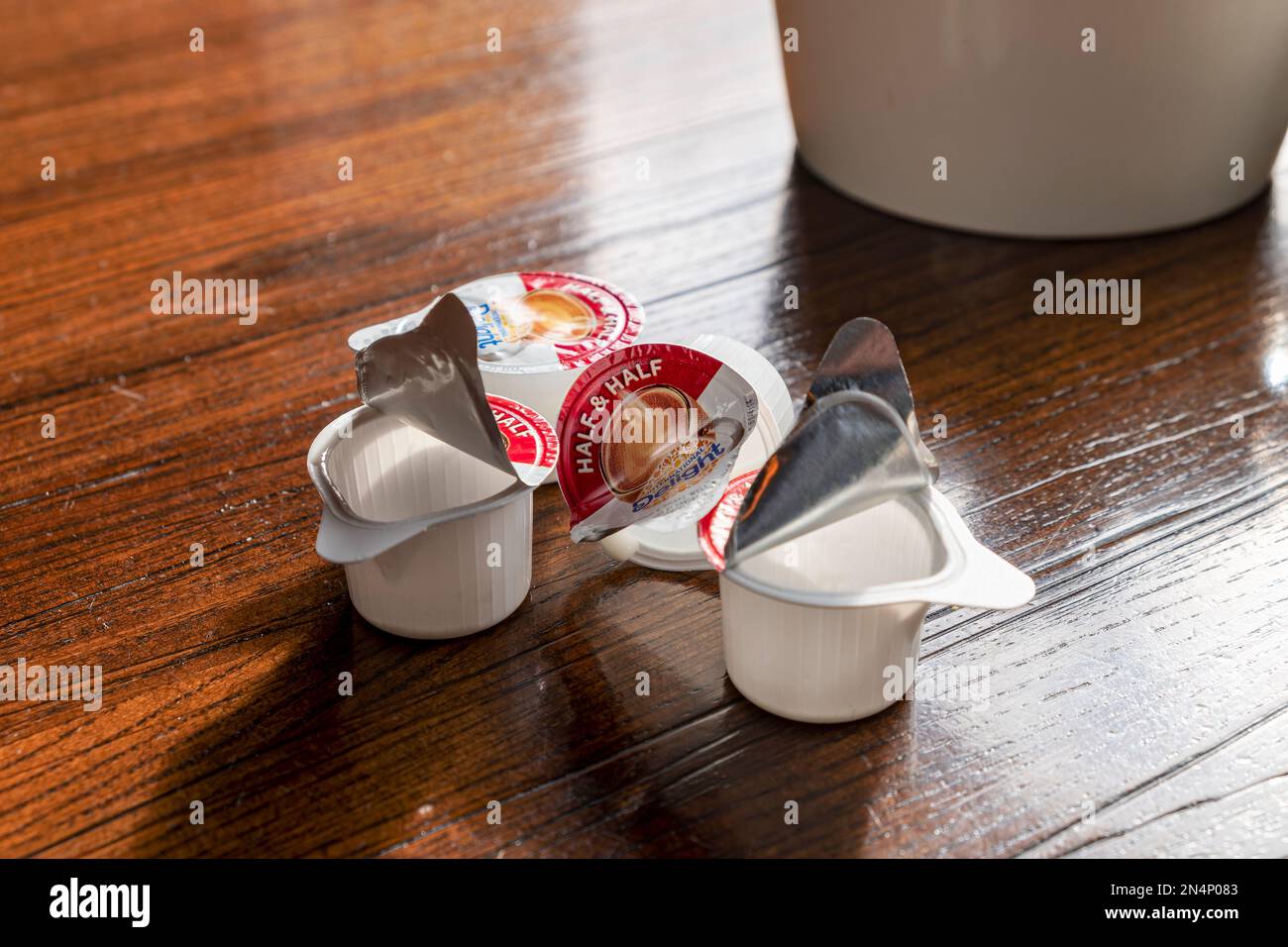 Empty coffee creamer cups hi-res stock photography and images - Alamy