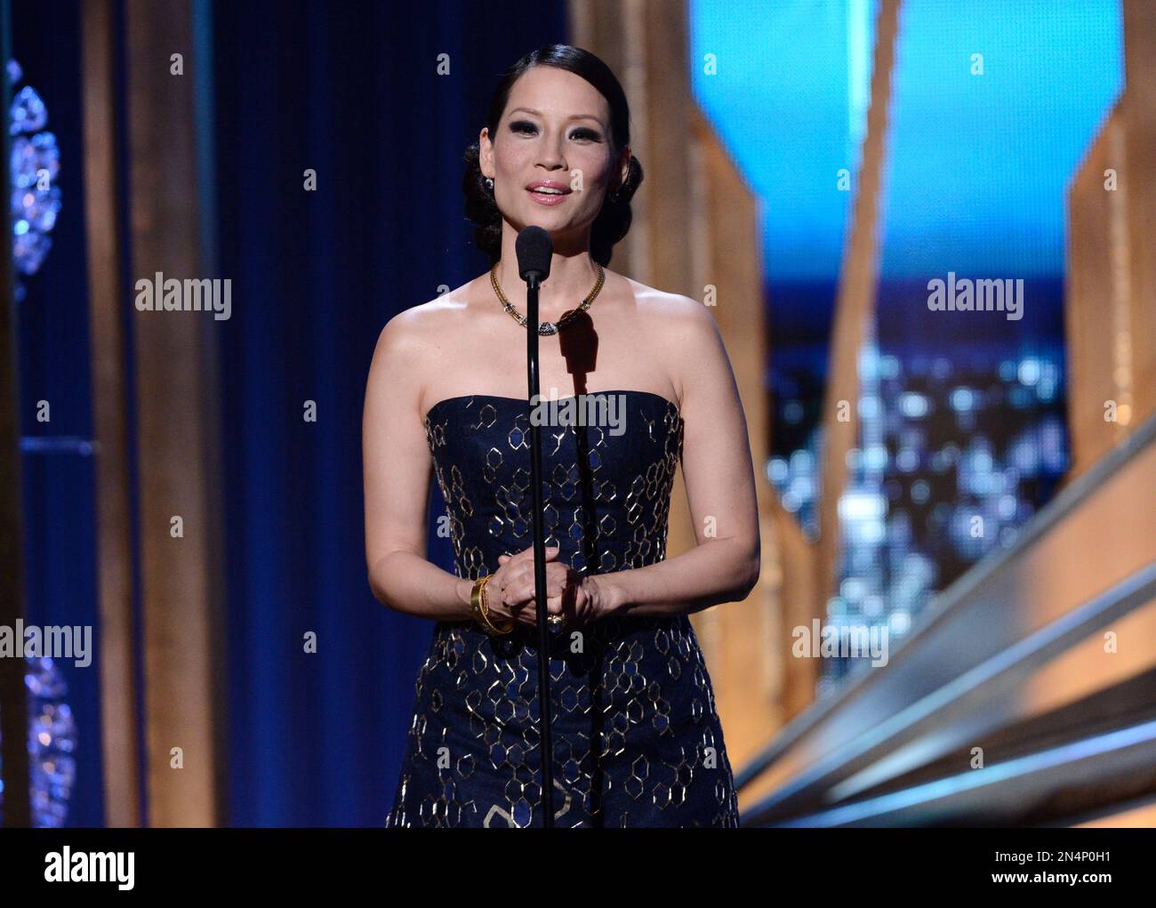 Co-host Lucy Liu speaks on stage at the Huading Film Awards at the ...
