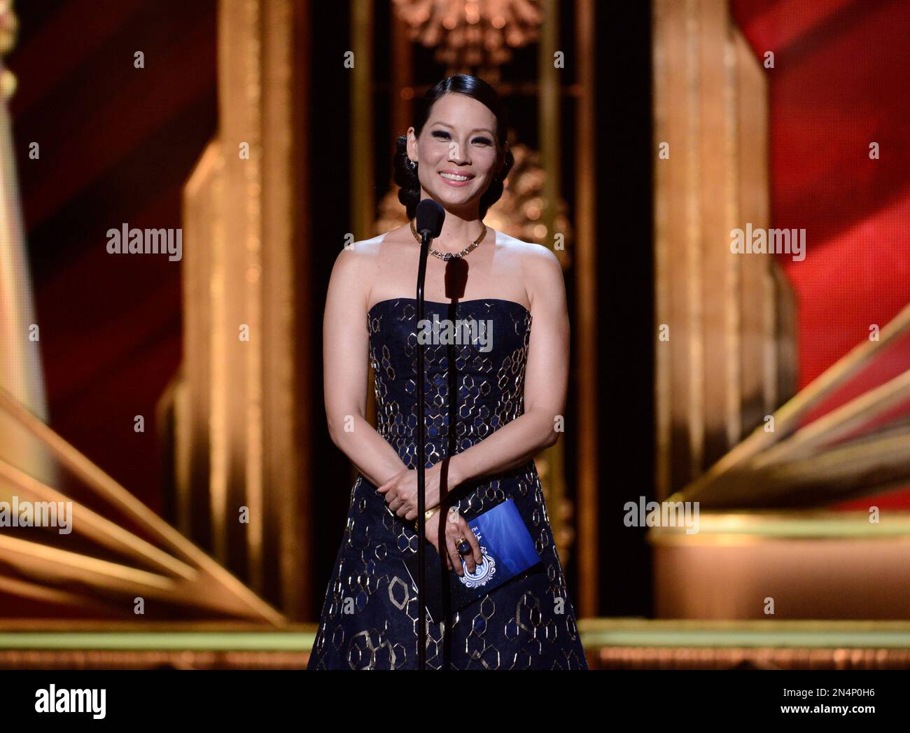 Co-host Lucy Liu speaks on stage at the Huading Film Awards at the ...