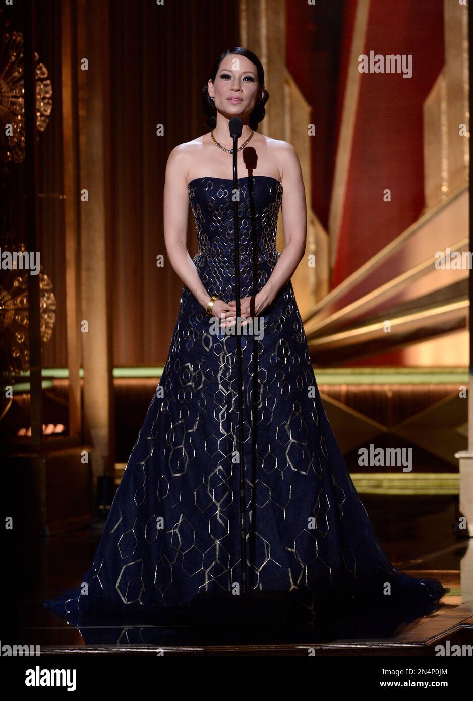 Co-host Lucy Liu speaks on stage at the Huading Film Awards at the ...