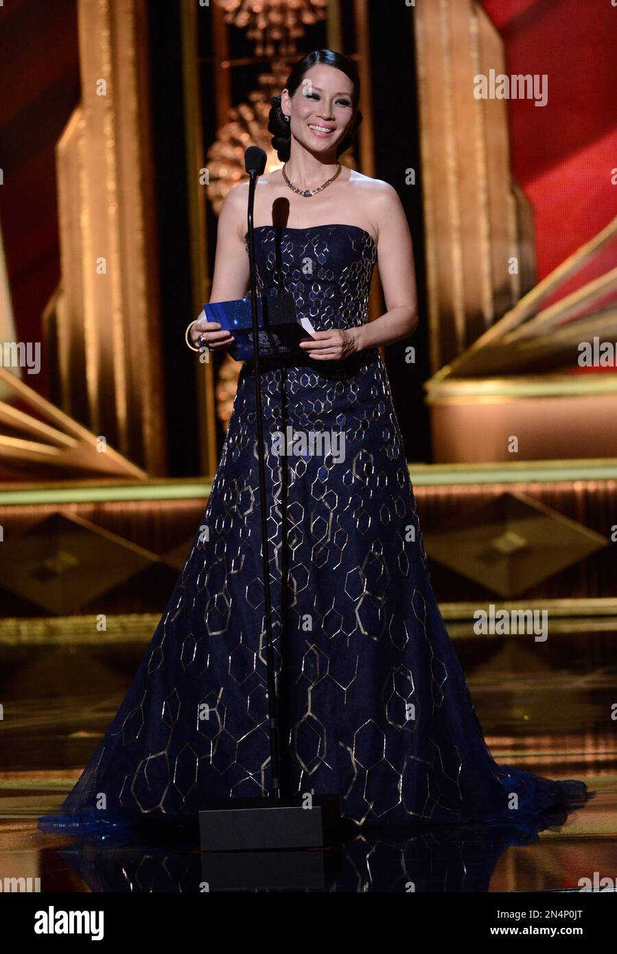 Co-host Lucy Liu speaks on stage at the Huading Film Awards at the ...