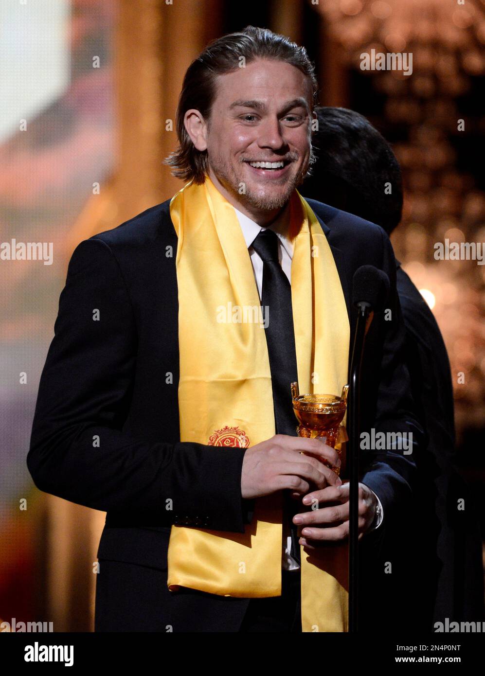 Charlie Hunnam accepts the best global emerging actor award on stage at ...