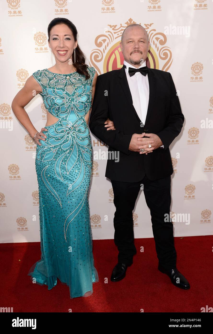 Estelle Simon, left, and Herve Renoh arrive at the Huading Film Awards ...