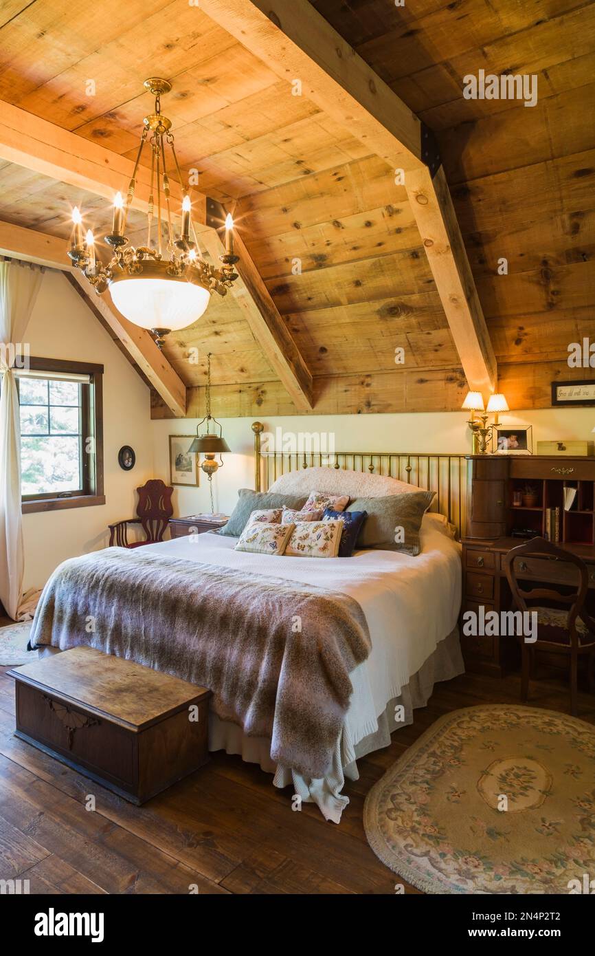 Master bedroom and king size bed with brass headboard, antique wooden ...