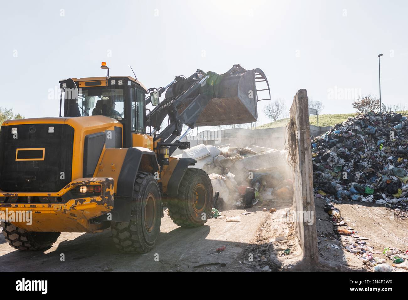 Heavy construction machine, front end loader moving along recycling ...