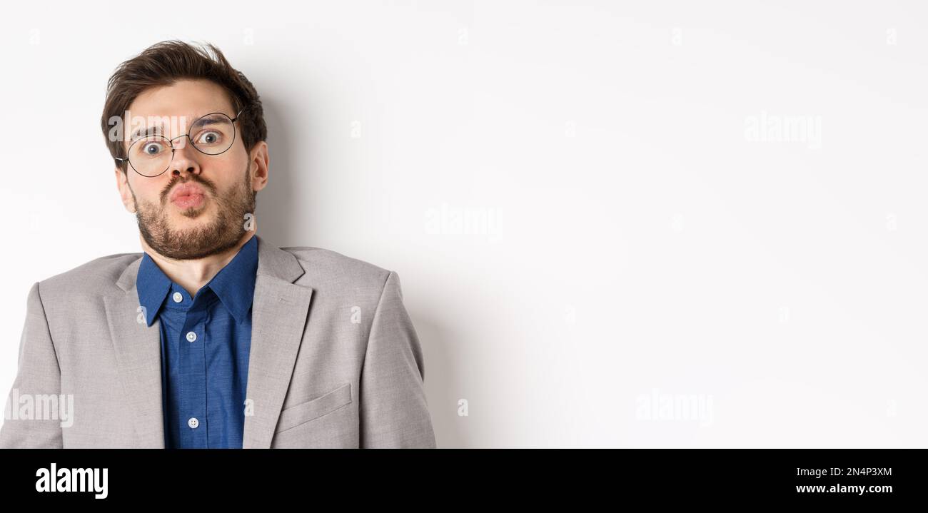 Startled guy in glasses and suit, tilt back and looking shocked or ...