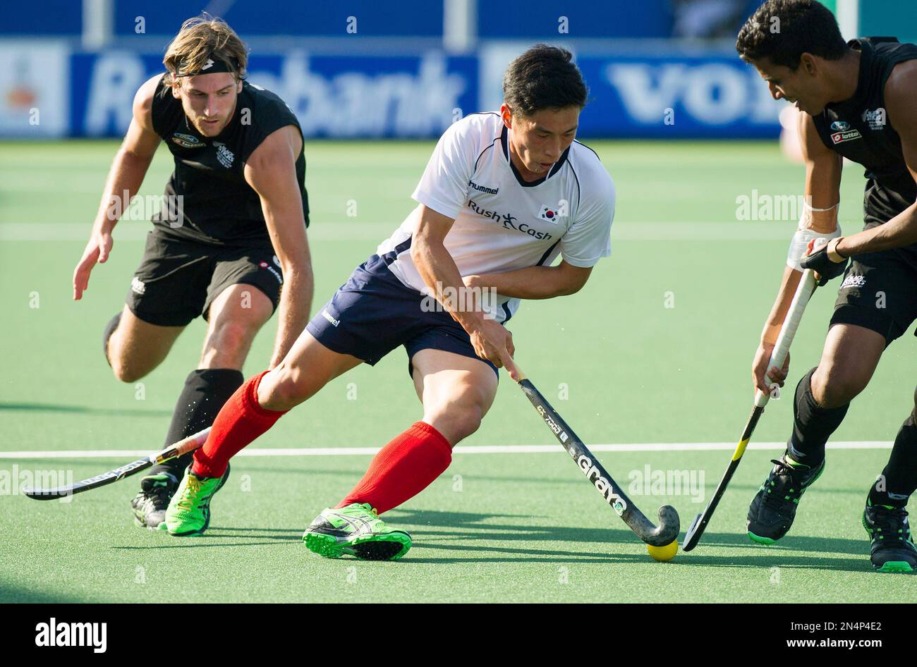 Korea's Hyesung Hyun, center, dribbles with the ball towards New ...