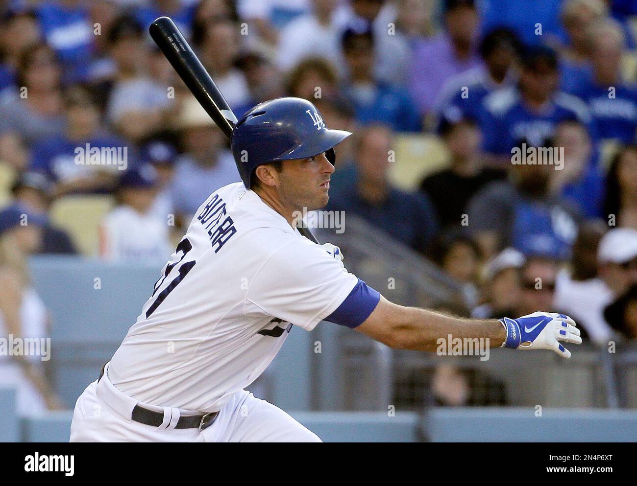 Los Angeles Dodgers' Drew Butera watches his triple against the ...