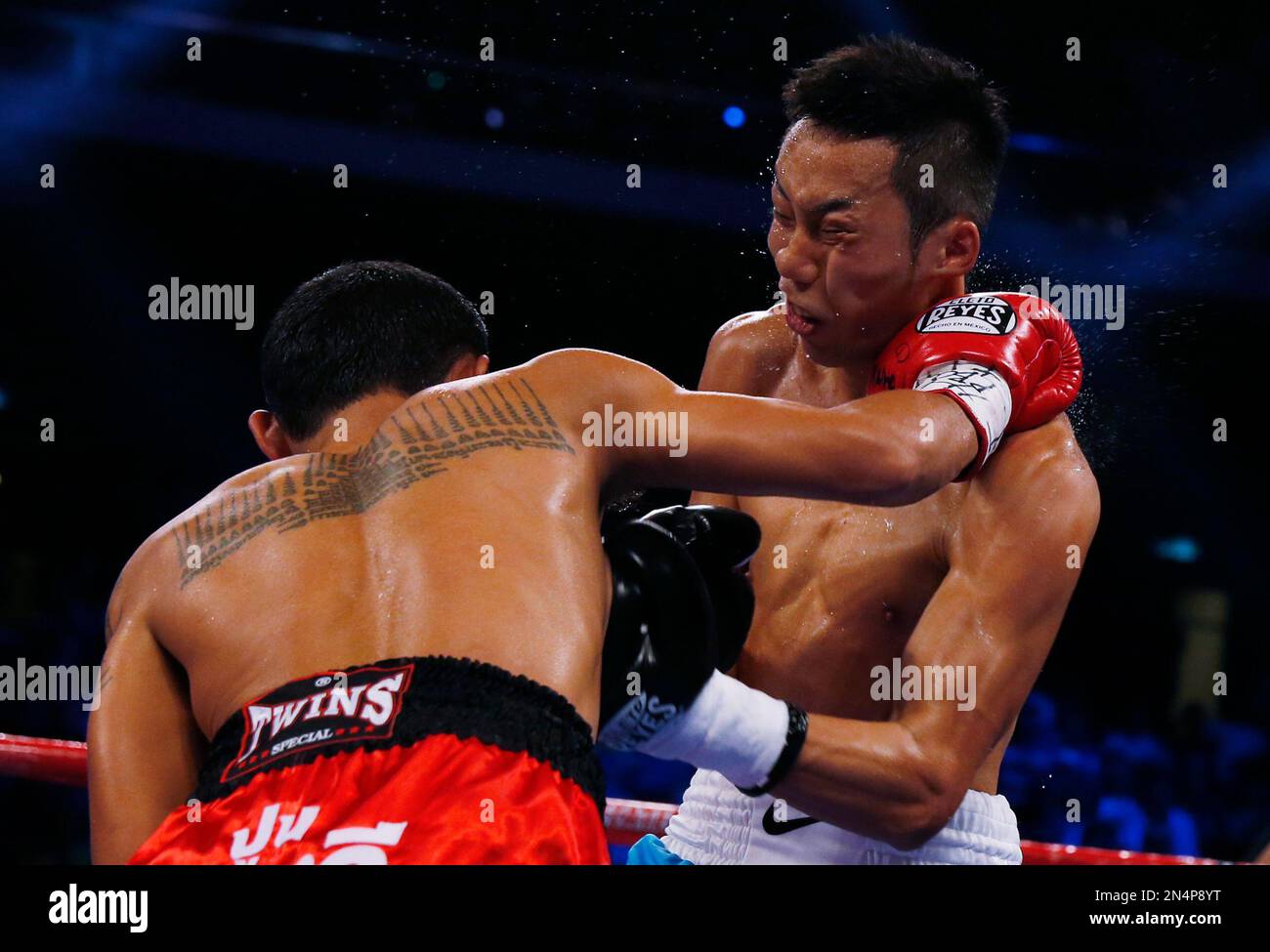 Rex “The Wonder Kid” Tso of Hong Kong, right, fights with Ratchasak ...