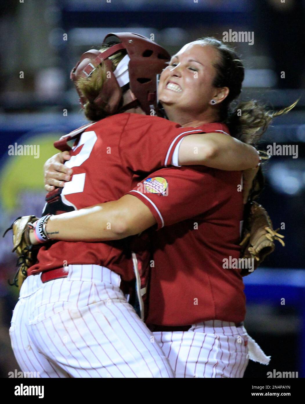 Alabama catcher Molly Fichtner, left, and pitcher Jaclyn Traina, right ...