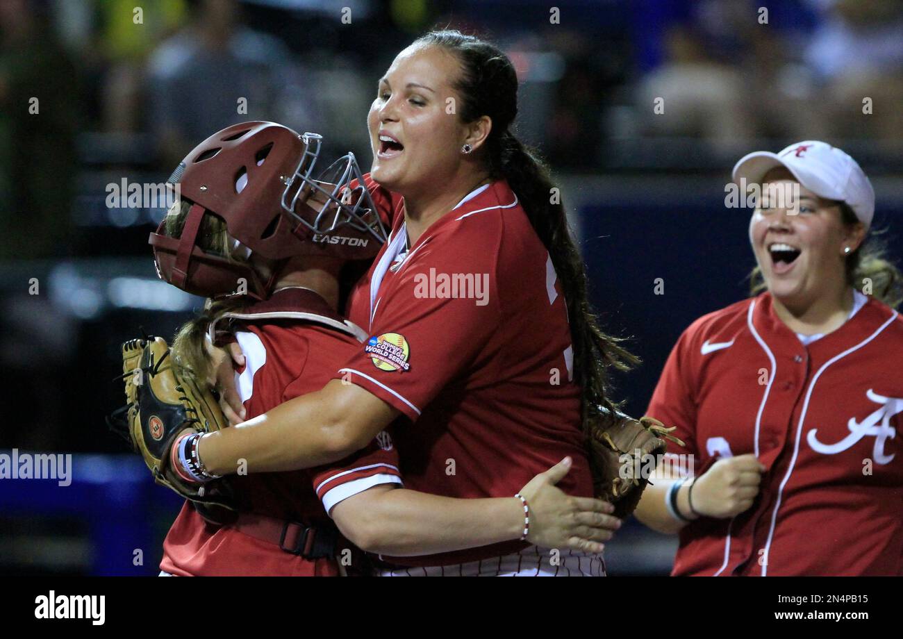Alabama catcher Molly Fichtner, left, and pitcher Jaclyn Traina, center ...