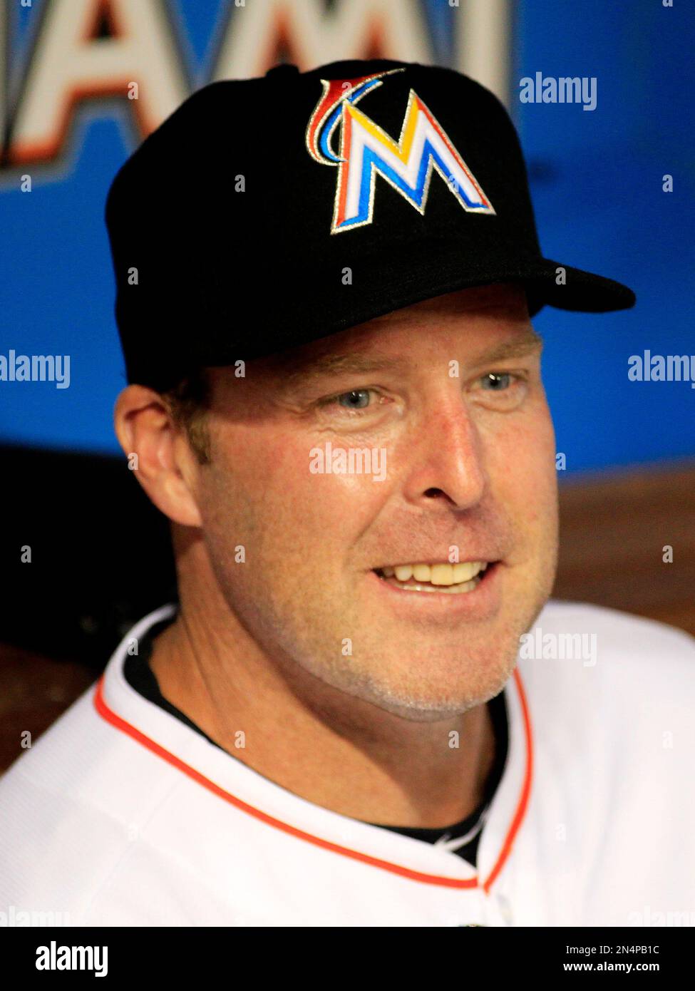 Miami Marlins manager Mike Redmond looks on from the dugout before his ...
