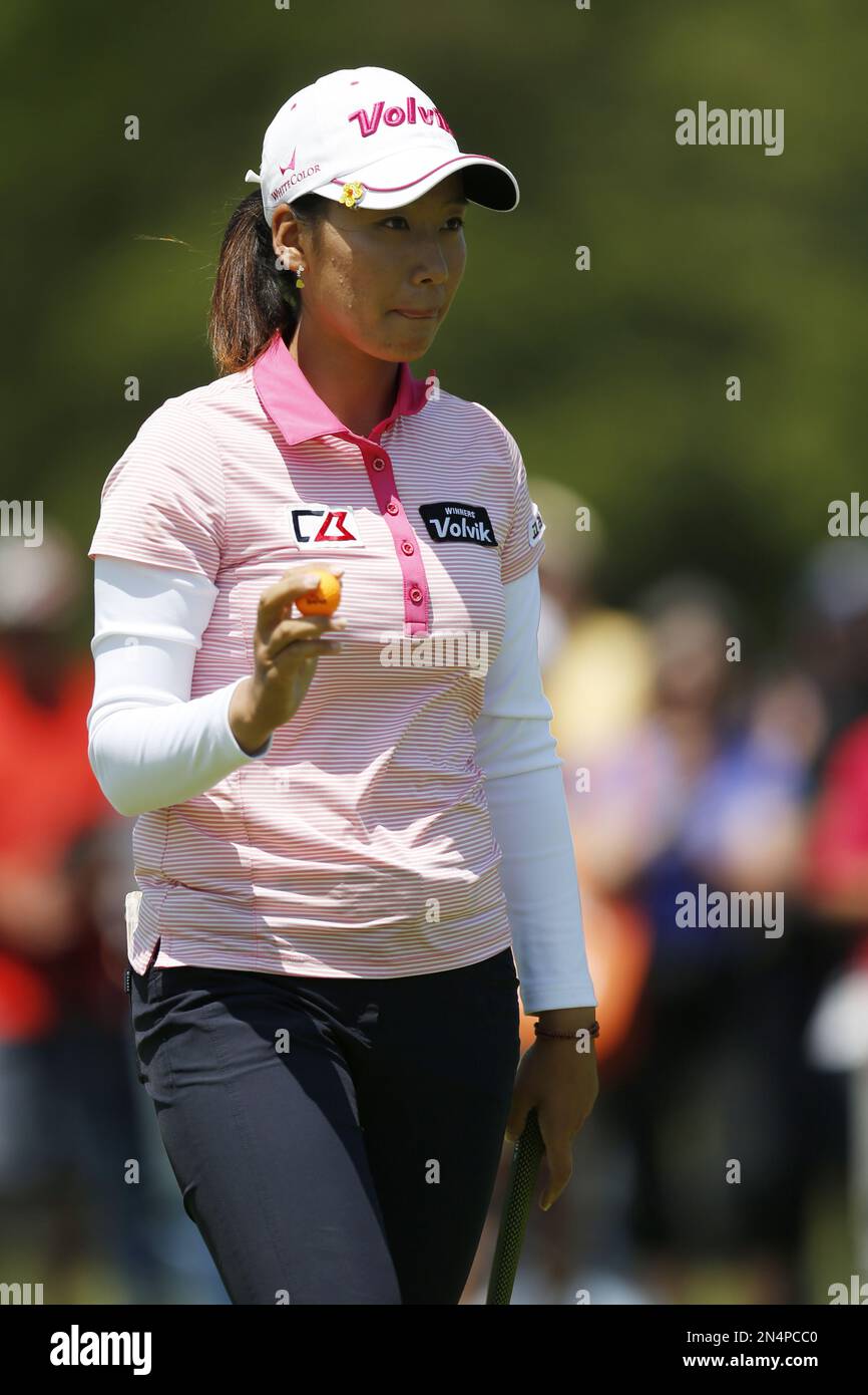 Chella Choi, of South Korea, acknowledges the crowd after sinking a putt on the 14th green ...