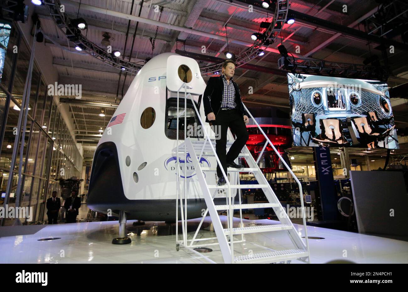 Elon Musk, CEO and CTO of SpaceX, walks down the steps while ...