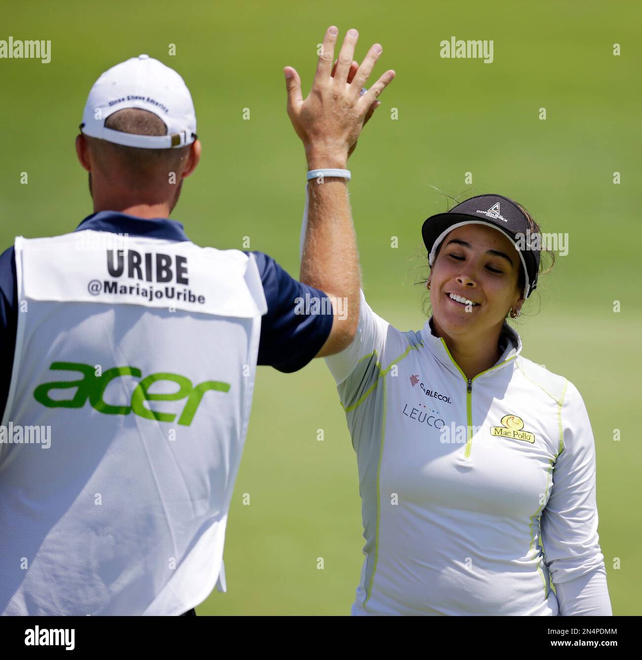 Mariajo Uribe, of Colombia, celebrates with her caddie Andy Techmeier ...